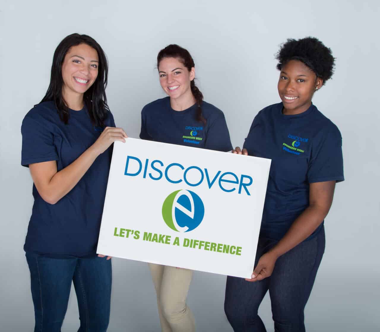 3 Young Women Hold DiscoverE Sign - DiscoverE